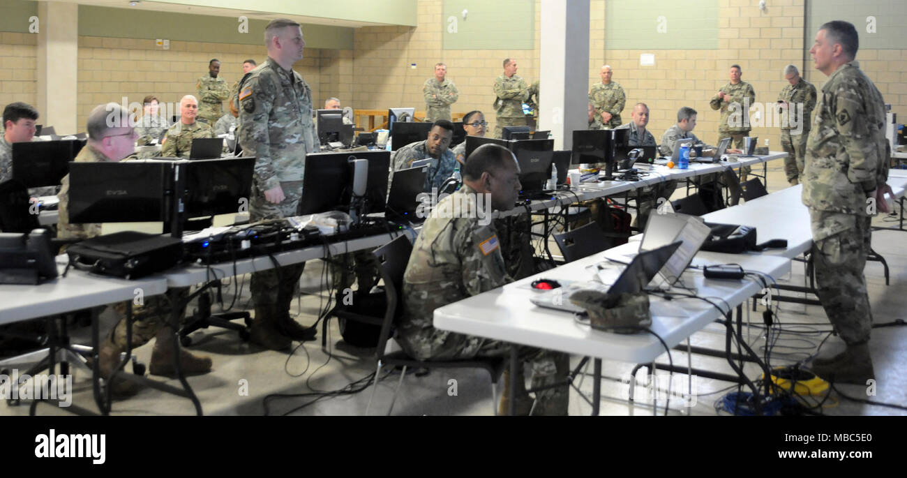 Master Sgt. Kevin Burr, 66th Troop Command (standing, left) explains ...