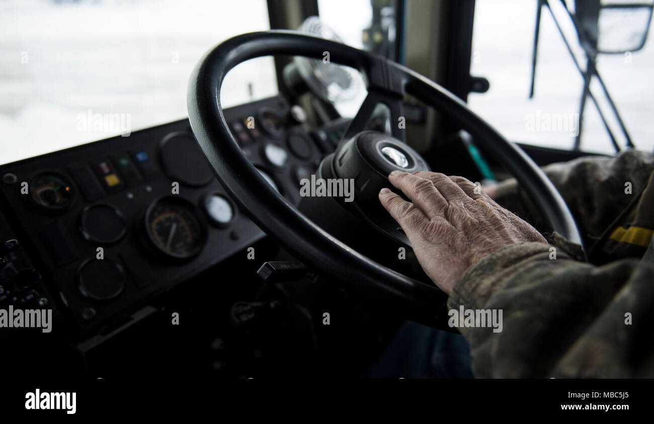 Eric Funke, 92nd Civil Engineer Squadron snow plow operator, clears the ...