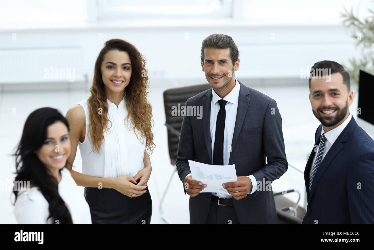 employees standing in a modern office Stock Photo - Alamy