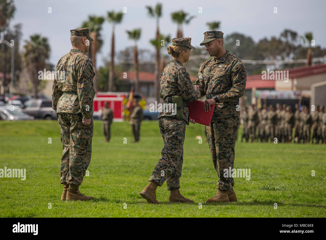 U.S. Marine Sgt. Maj. Stennett Rey receives an award from Lt. Col ...