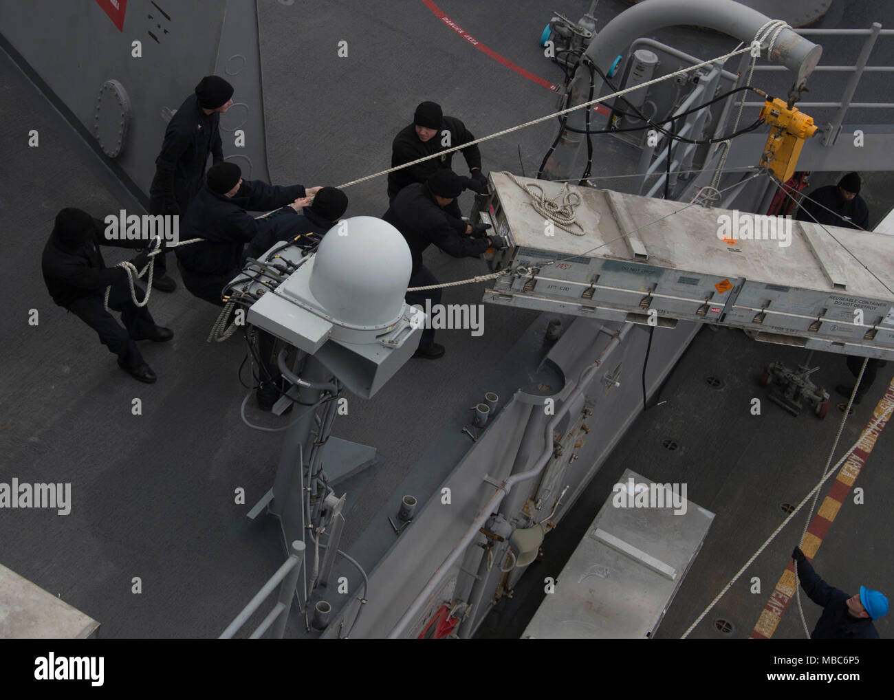 ATLANTIC OCEAN (Feb. 14, 2018) Sailors hoist a Rolling Airframe Missile ...