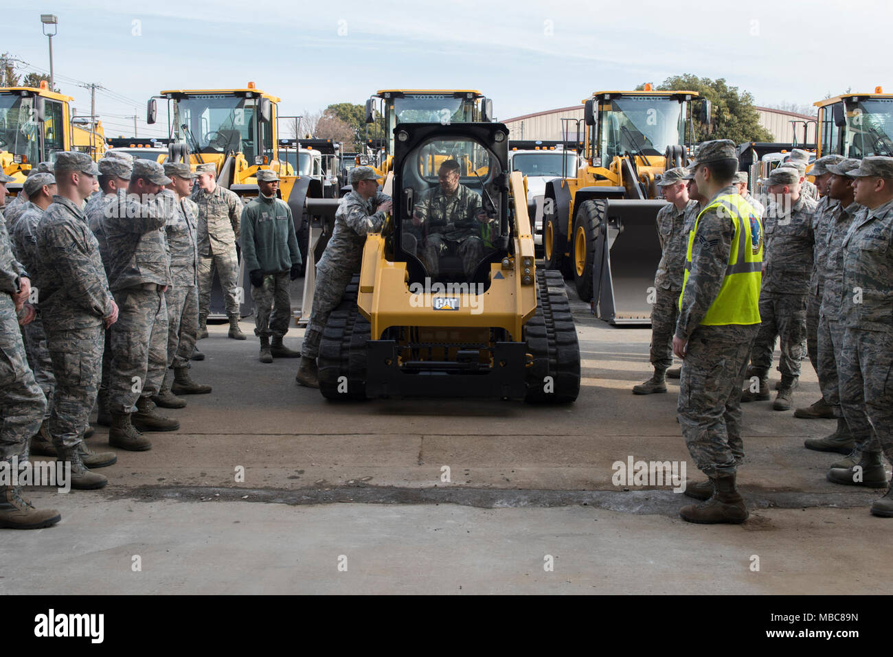 Col. John Winkler, 374th Mission Support Group commander, receives ...