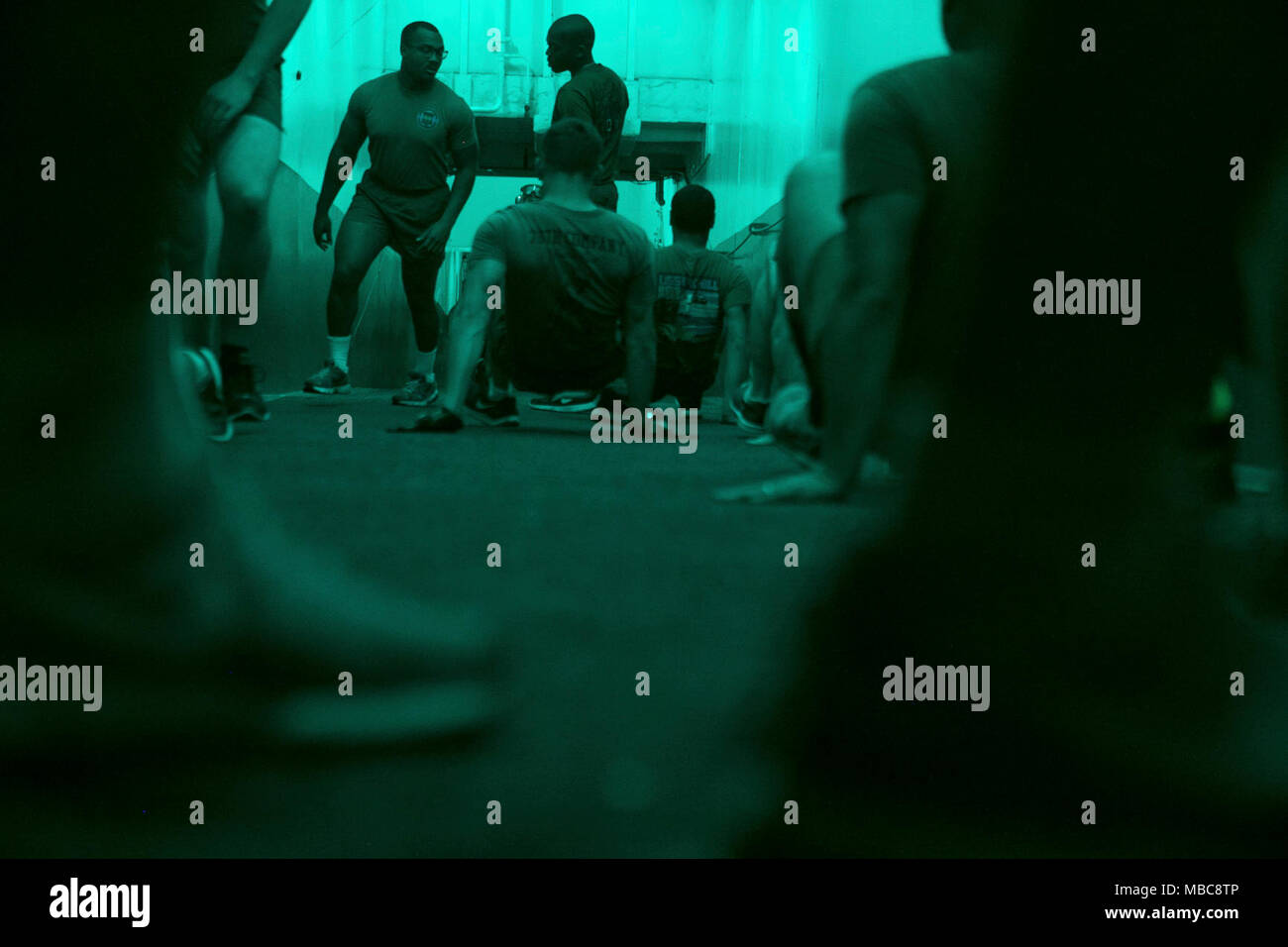 U.S. Marines with the 26th Marine Expeditionary Unit, crab walk down a ...