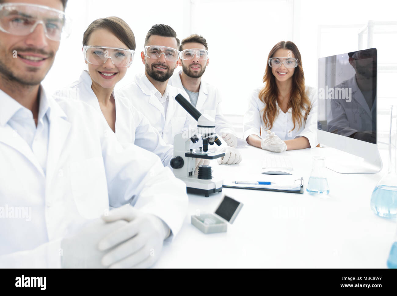 Male scientist and the team in the lab Stock Photo - Alamy