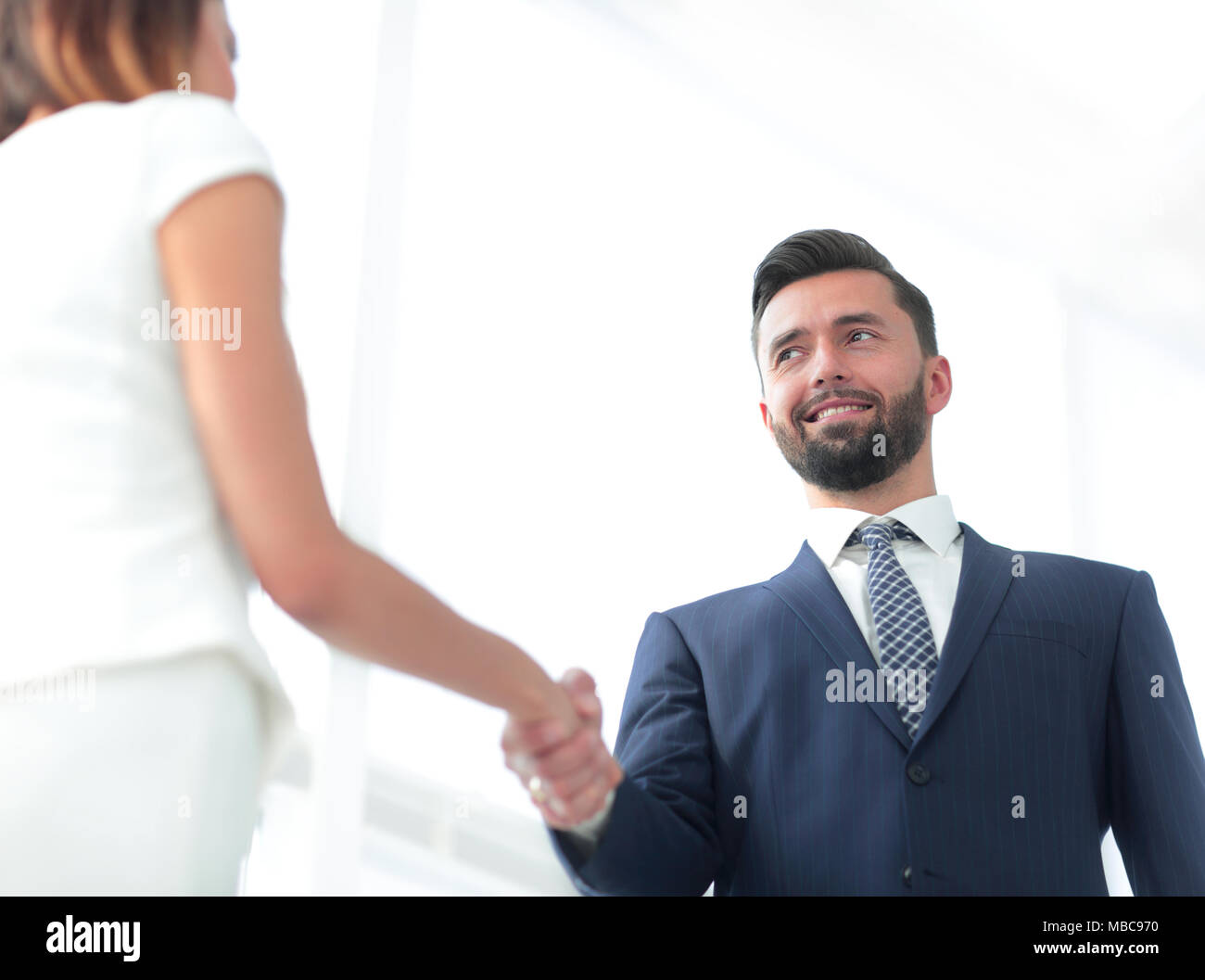 Image of business partners handshaking in office Stock Photo - Alamy