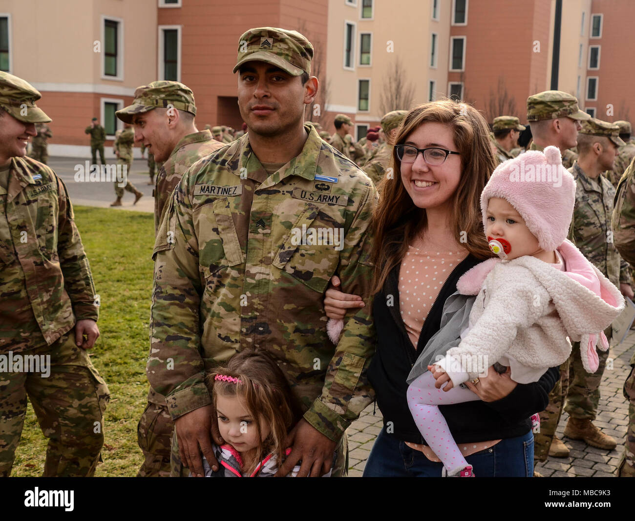 A Soldier is surrounded by his loving family after earning his Expert ...