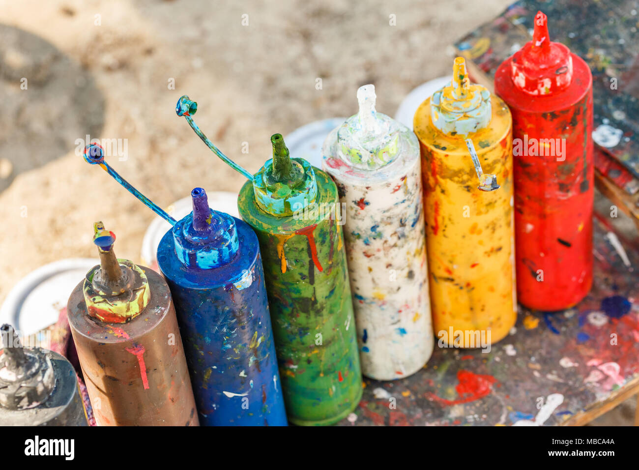 Paint bottles to be squeezed for art and craft education background ...