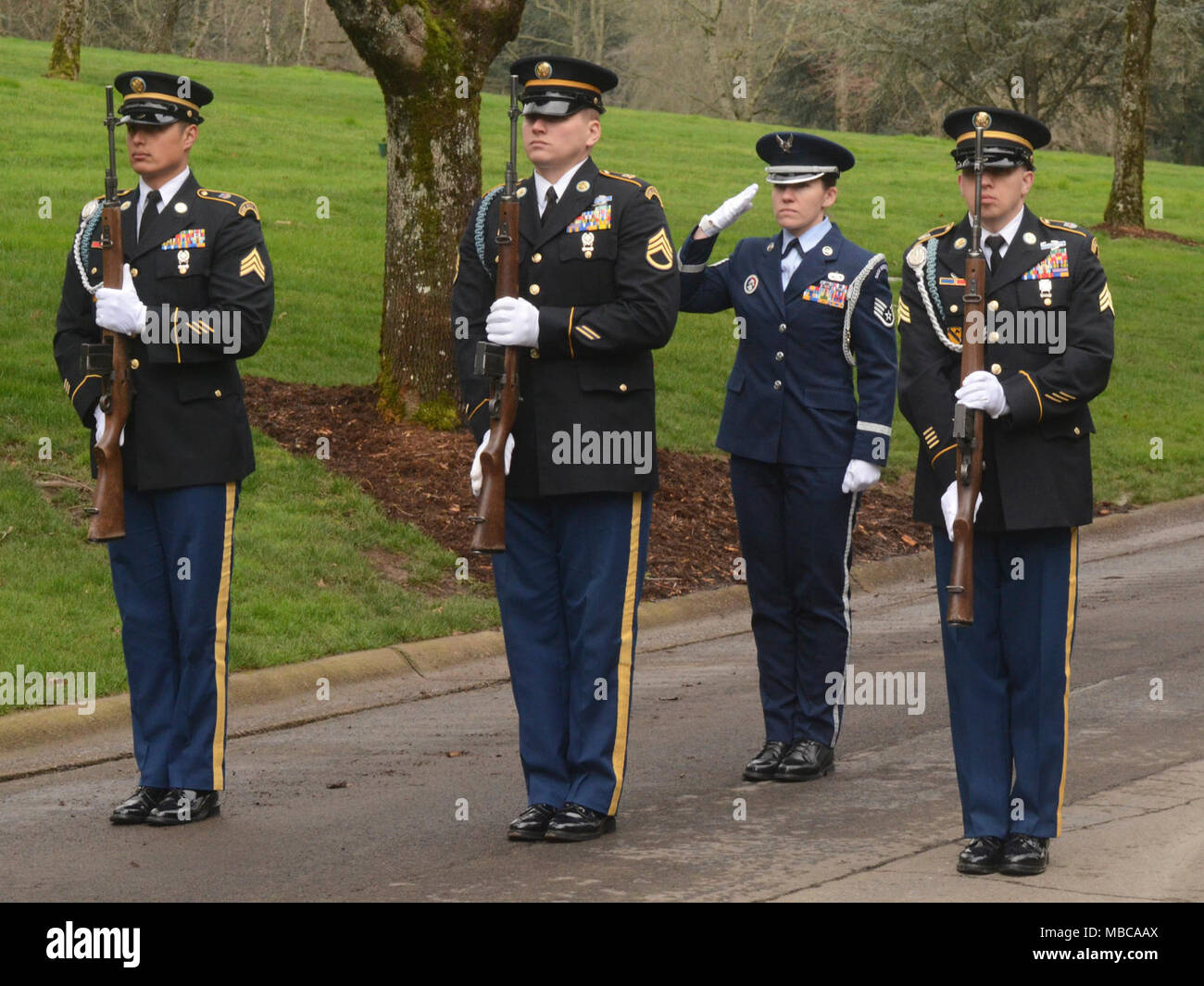 U.S. Air Force Staff Sgt. Kalene Kaplan (center right) performs firing ...