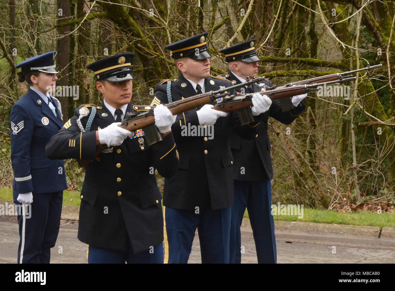 U.S. Air Force Staff Sgt. Kalene Kaplan (left) gives firing party ...