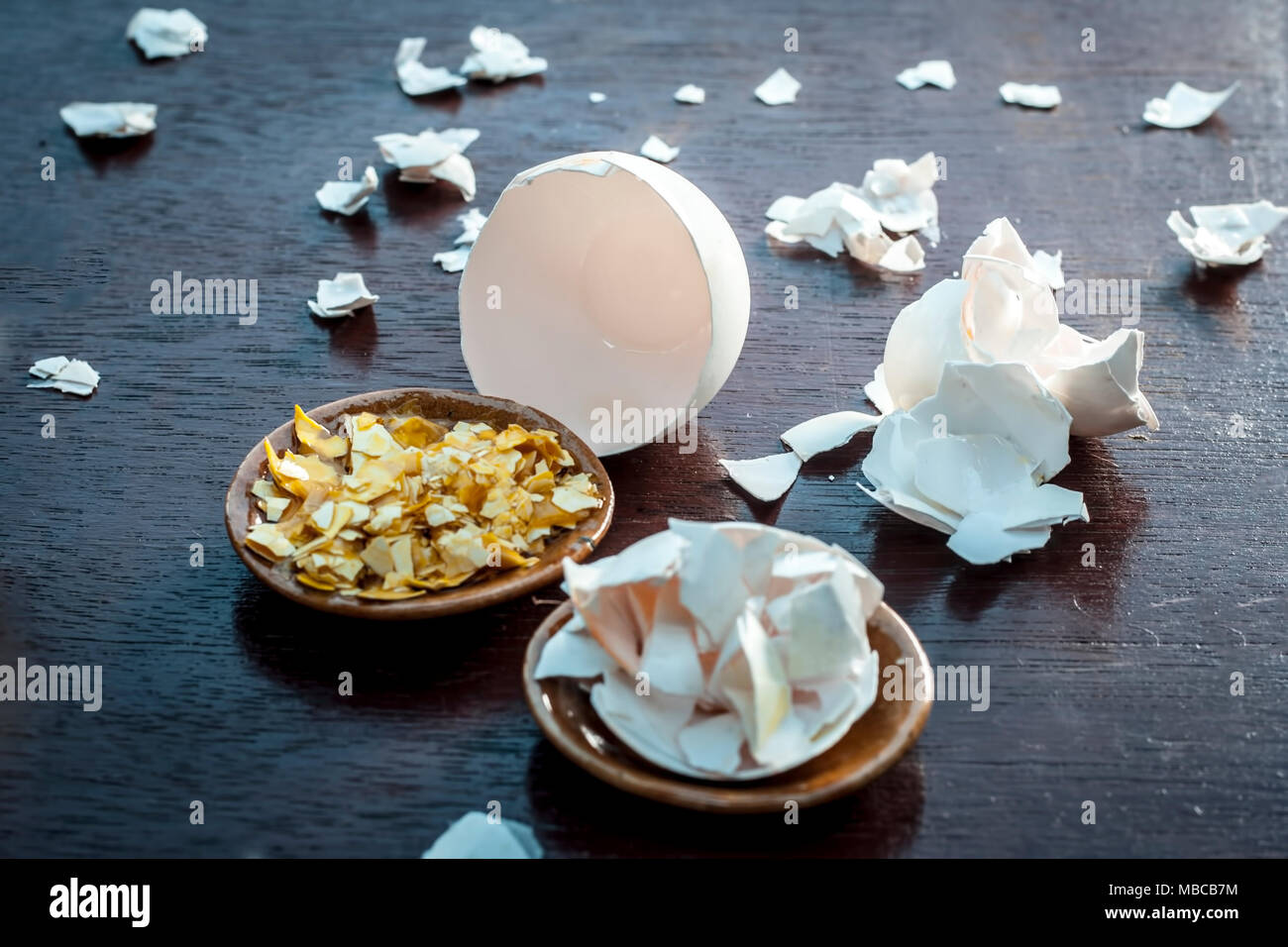 Close up of face pack consisting of egg peel and honey on a wooden ...