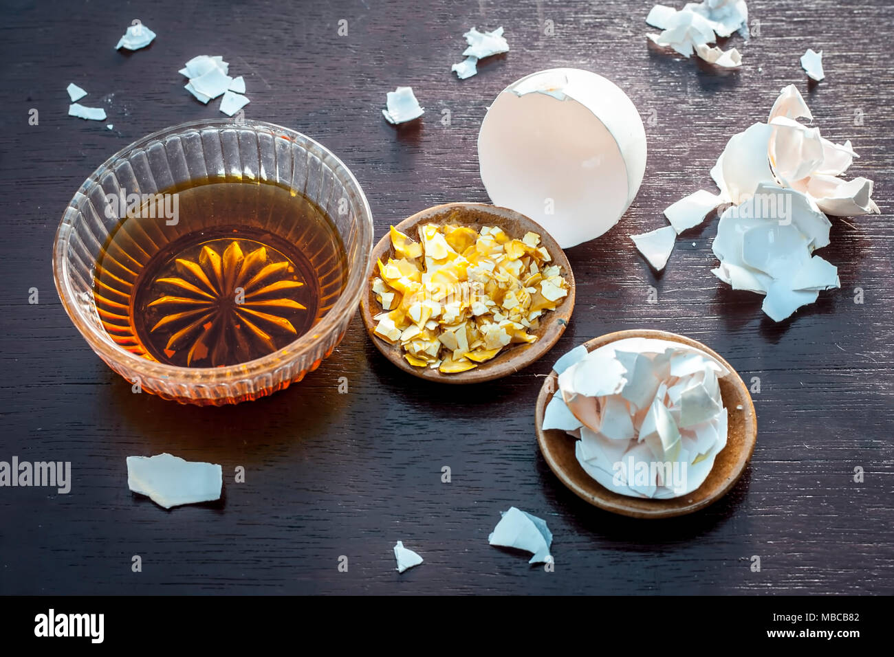 Close up of face pack consisting of egg peel and honey on a wooden ...