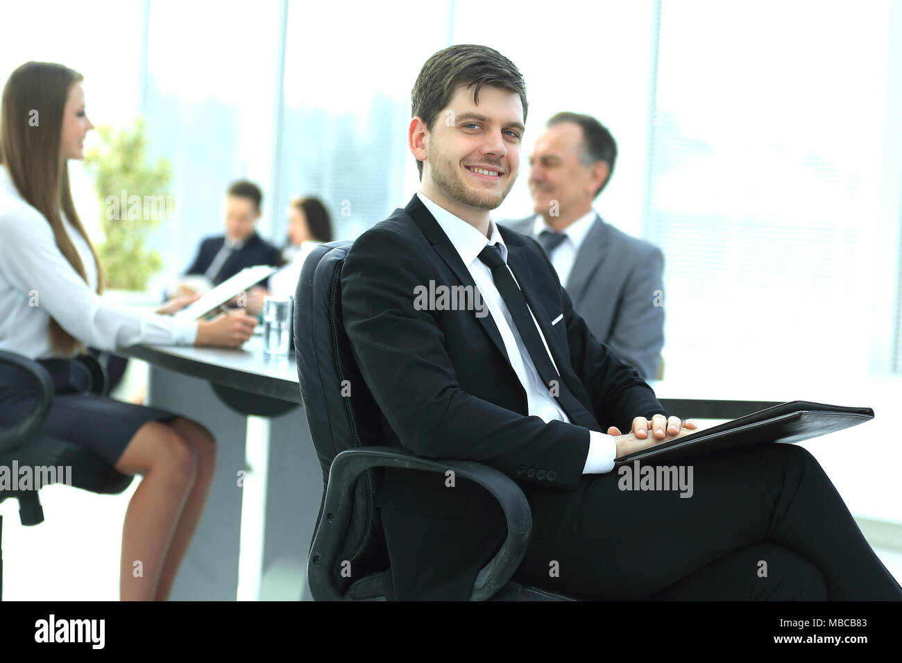 business man at office with his business team working behind Stock ...