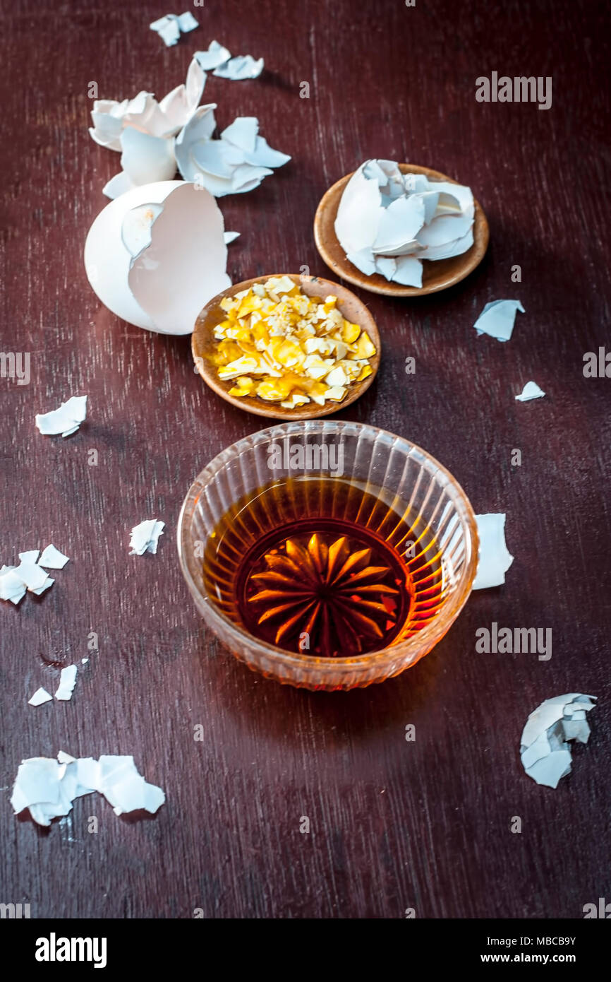 Close up of face pack consisting of egg peel and honey on a wooden ...