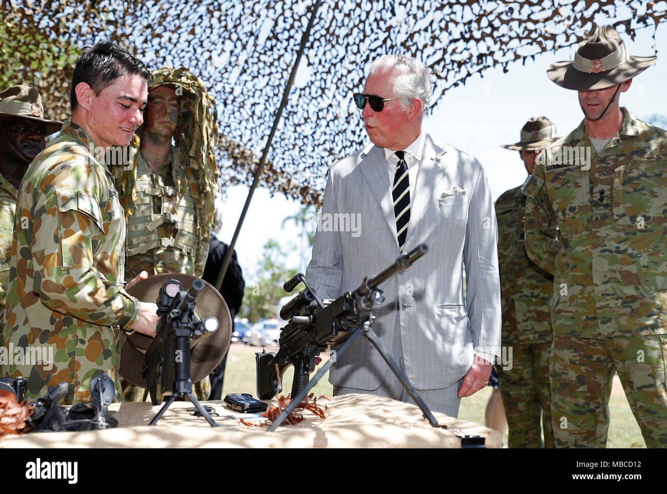 The Prince of Wales views displayed weapons during a visit to NORFORCE ...