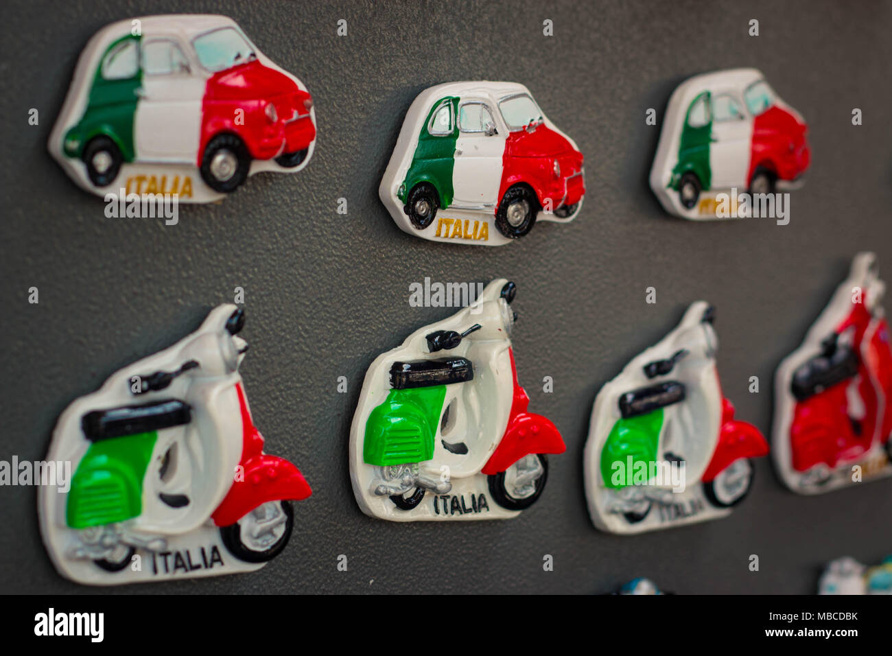 Souvenir magnets with typical italian cars and motocycles in italian ...