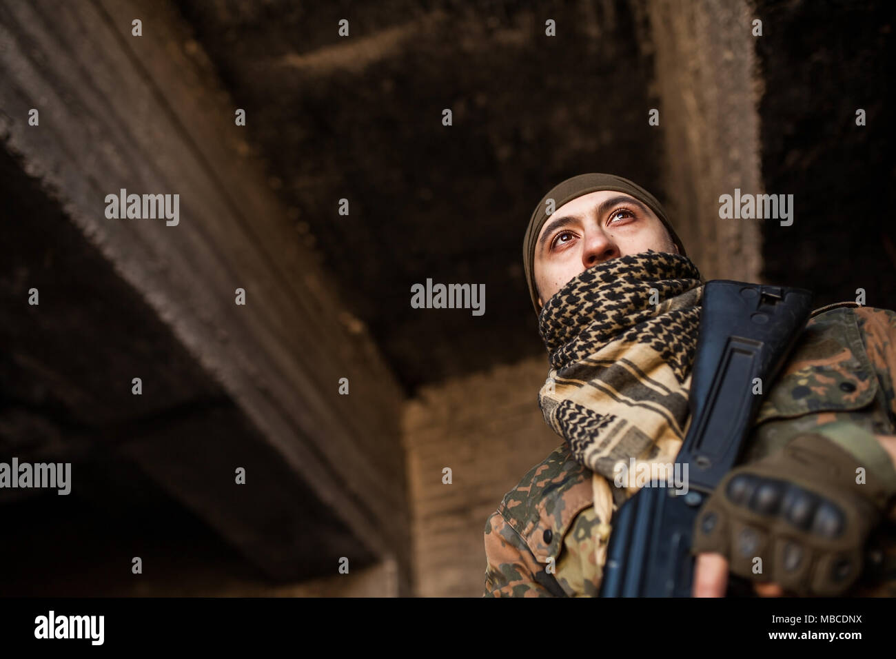 The Arab soldier with the AK-47 Kalashnikov assault rifle Stock Photo ...