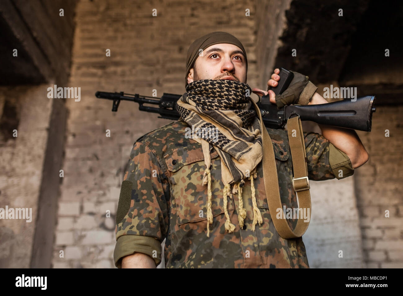 The Arab soldier with the AK-47 Kalashnikov assault rifle Stock Photo ...
