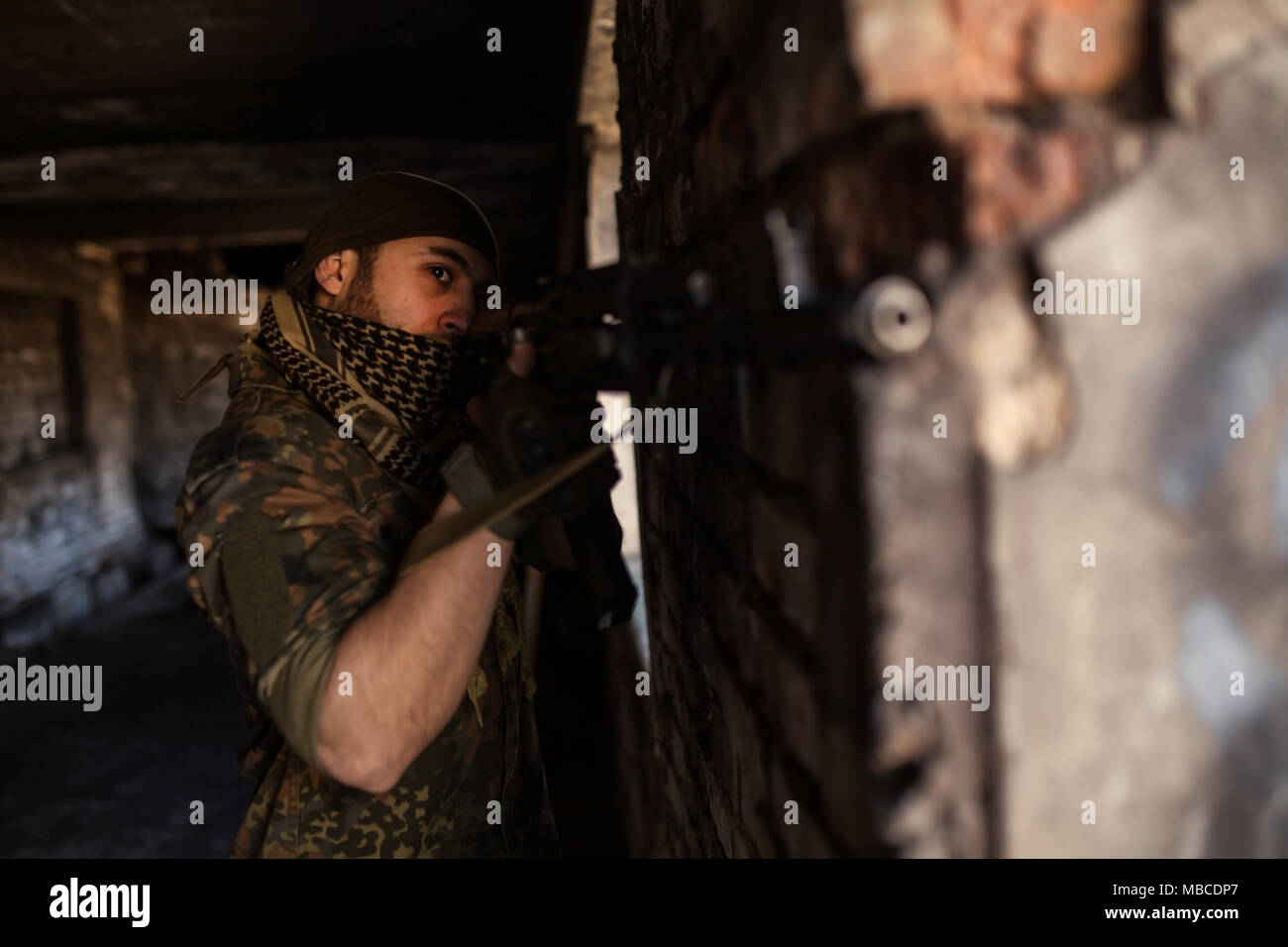 Arab soldier aiming with Kalashnikov AK-47 assault rifle Stock Photo ...