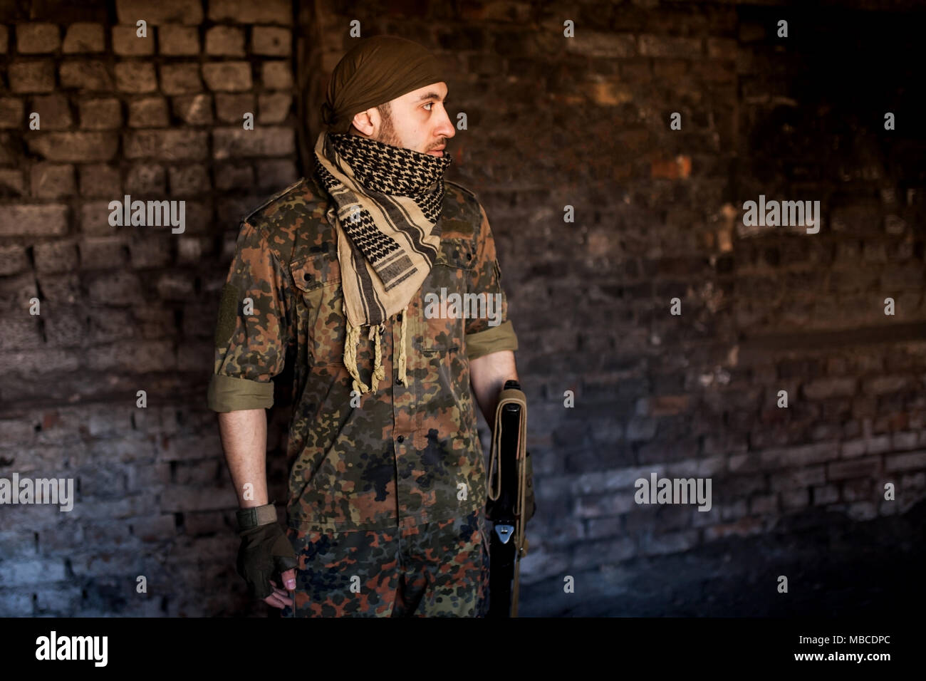 The Arab soldier with the AK-47 Kalashnikov assault rifle Stock Photo ...