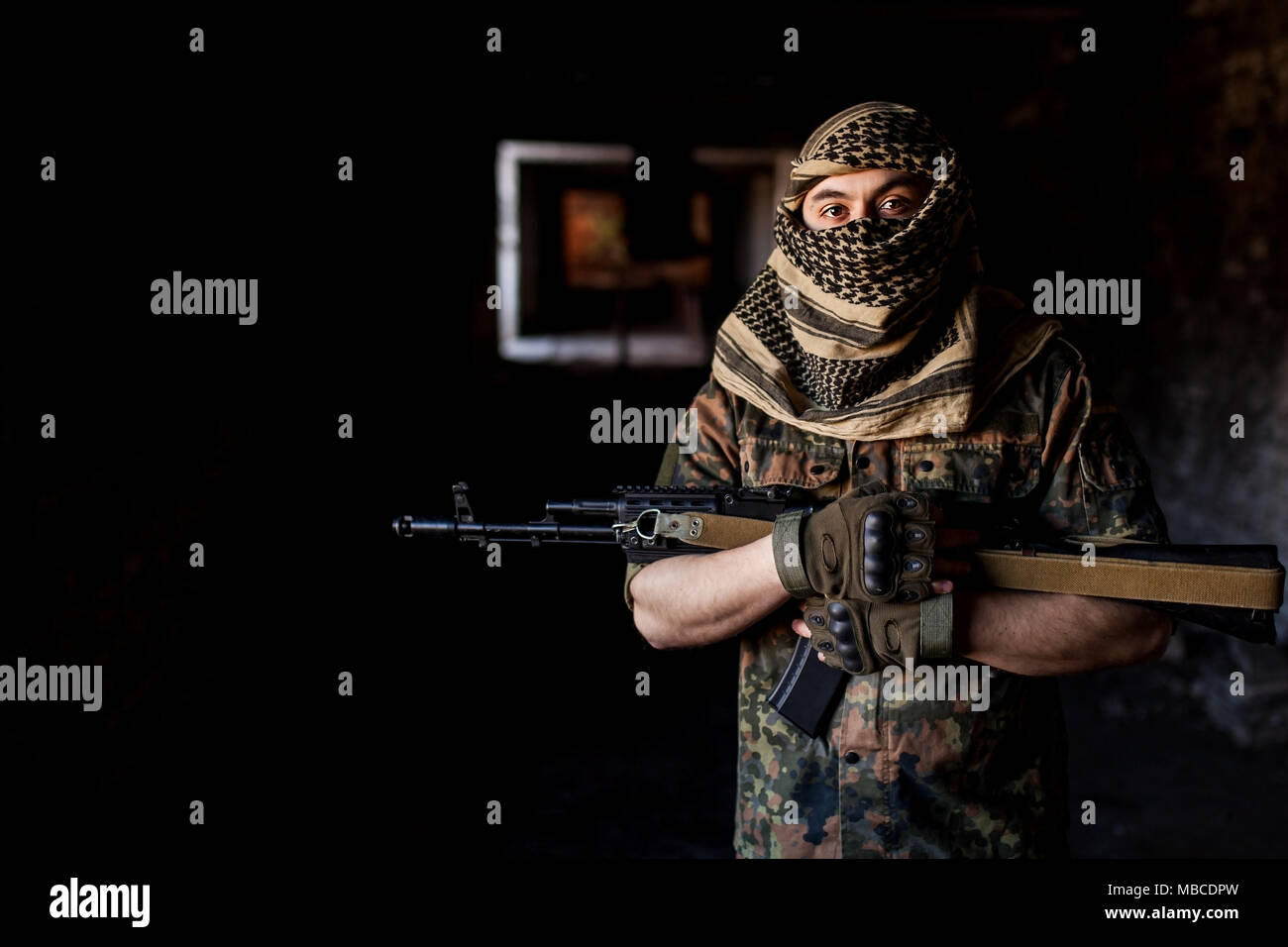 The Arab soldier with the AK-47 Kalashnikov assault rifle Stock Photo ...