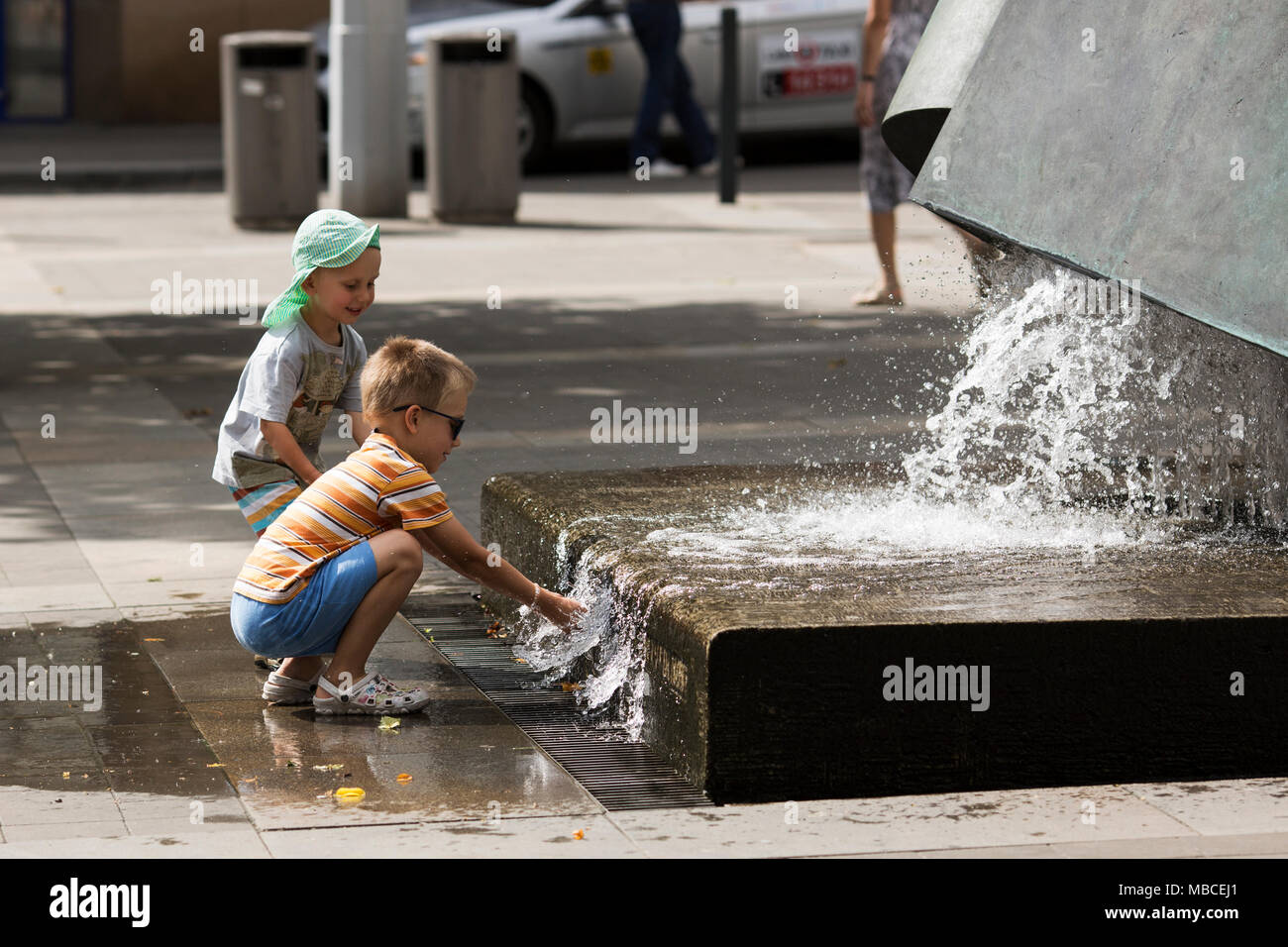Two boys play in water hi-res stock photography and images - Alamy