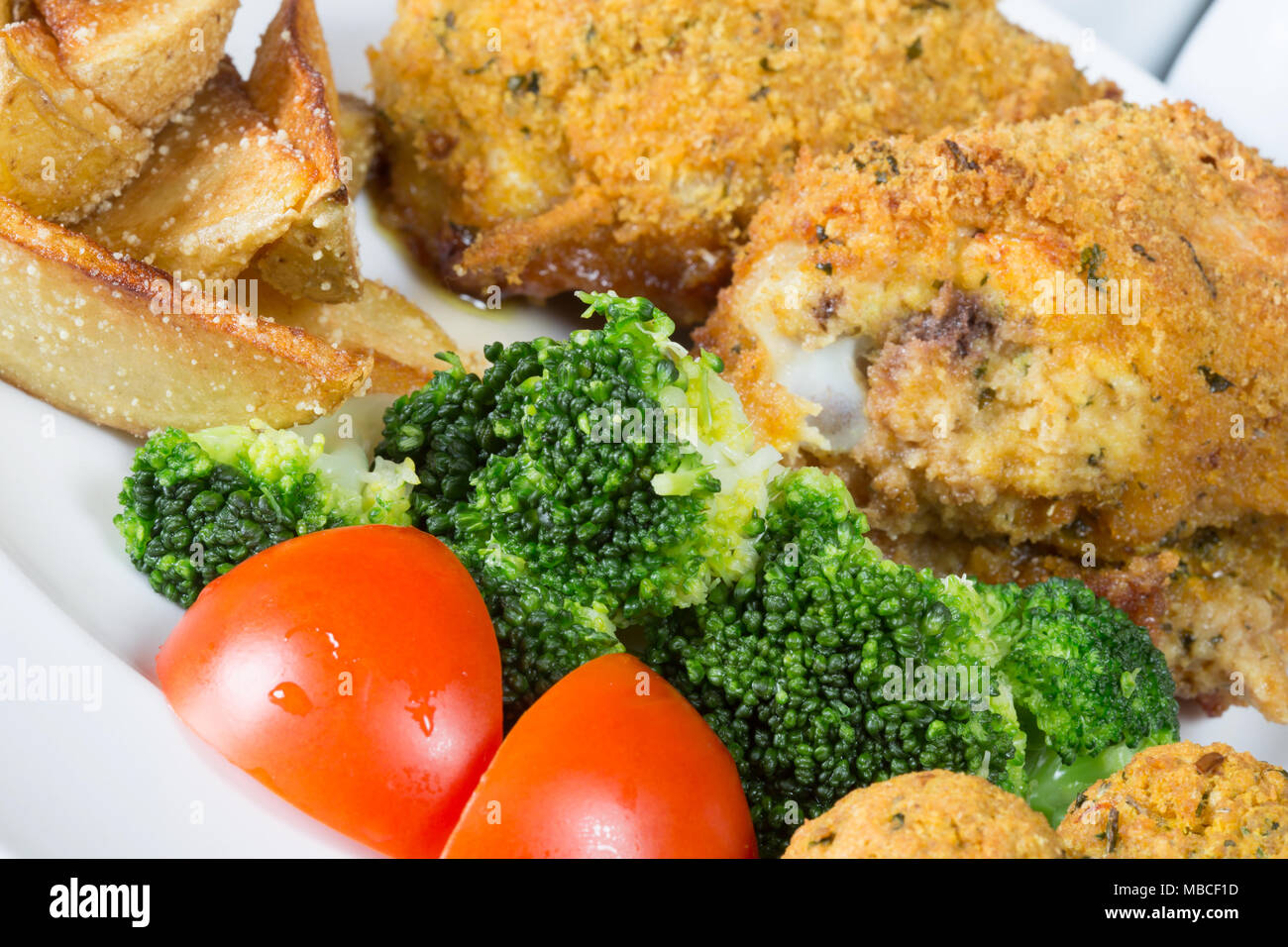 An English pub/restaurant dish of Golden fried breaded Chicken thighs ...