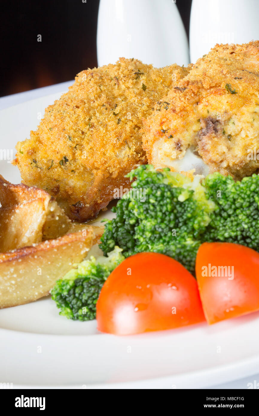 An English pub/restaurant dish of Golden fried breaded Chicken thighs ...