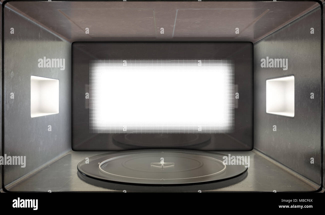 A close view from inside an operational household microwave looking ...