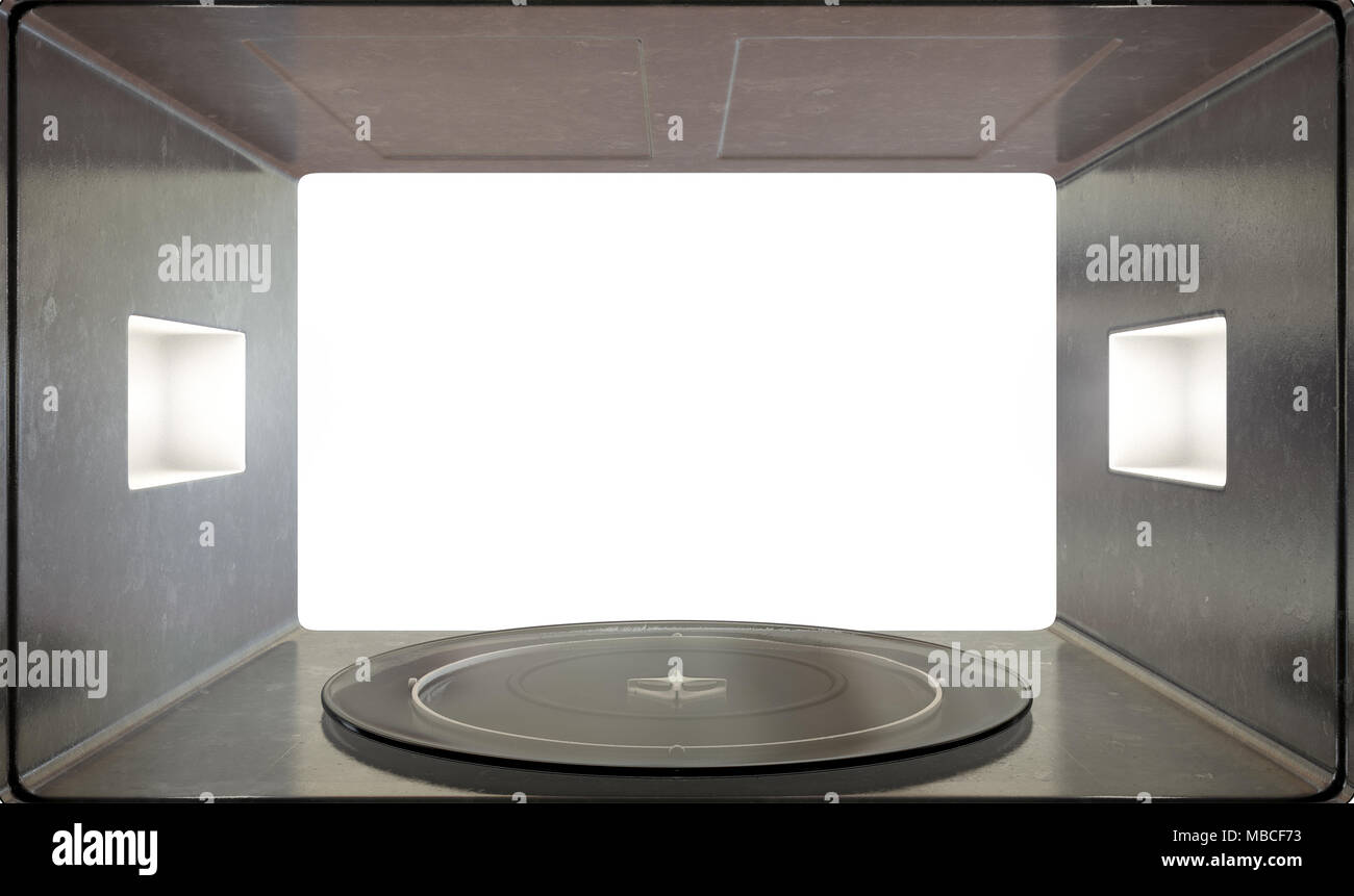 A close view from inside an operational household microwave looking ...