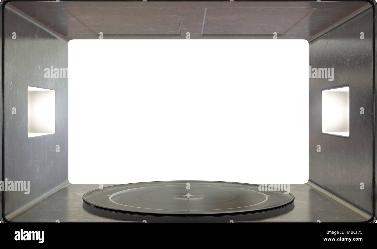 A close view from inside an operational household microwave looking ...