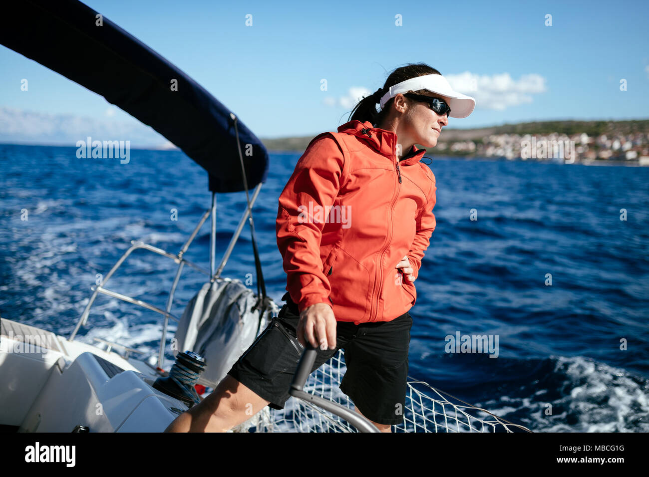 Attractive strong woman sailing with her boat Stock Photo - Alamy