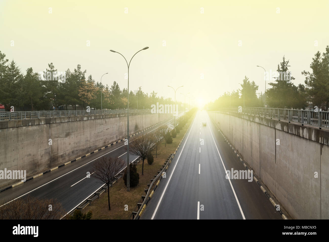 Highway and trees Stock Photo - Alamy