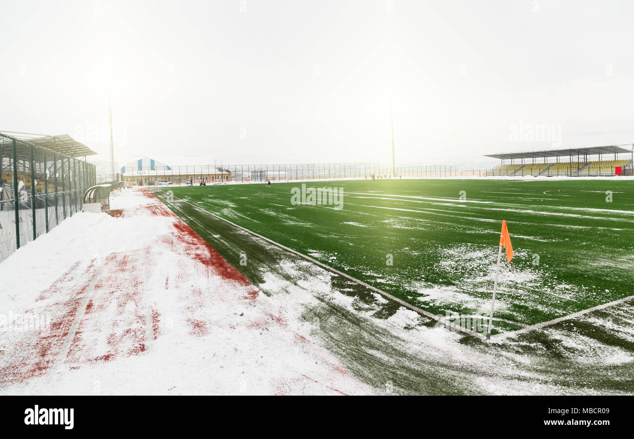 Soccer field and tribunes under snow Stock Photo - Alamy
