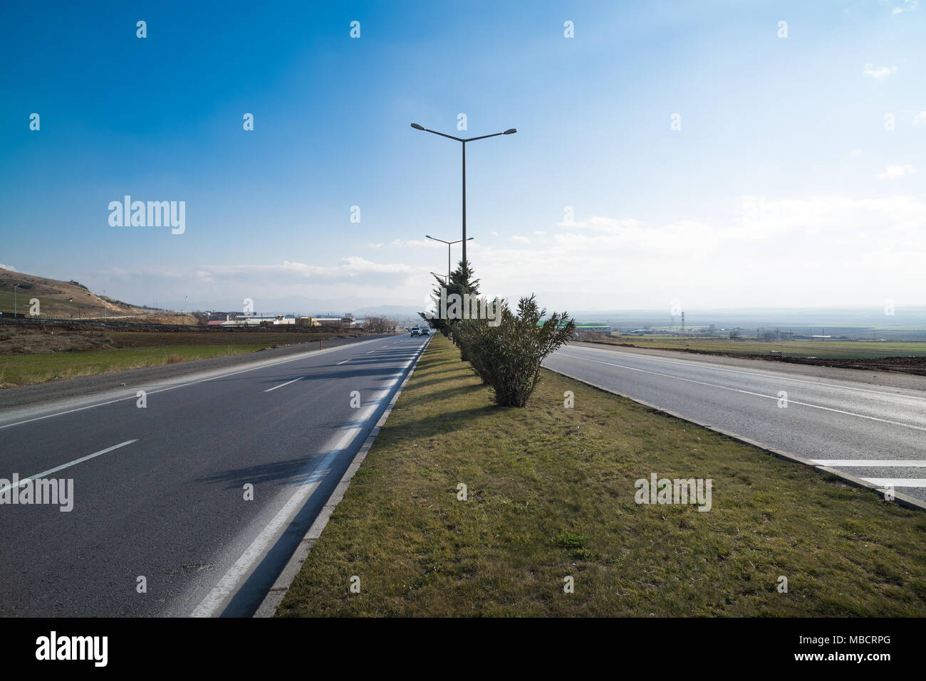 Highway and trees Stock Photo - Alamy