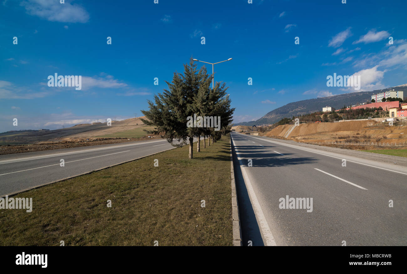 Highway and trees Stock Photo - Alamy