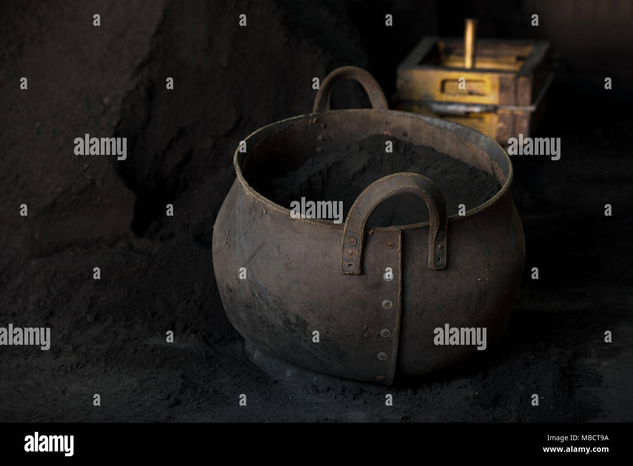 Foundry workshop equipment, metal melting pots and sand Stock Photo - Alamy