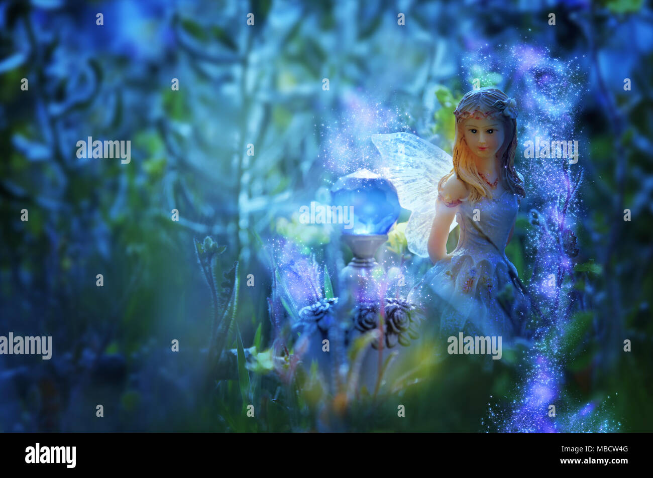 image of magical little fairy in the night forest Stock Photo - Alamy