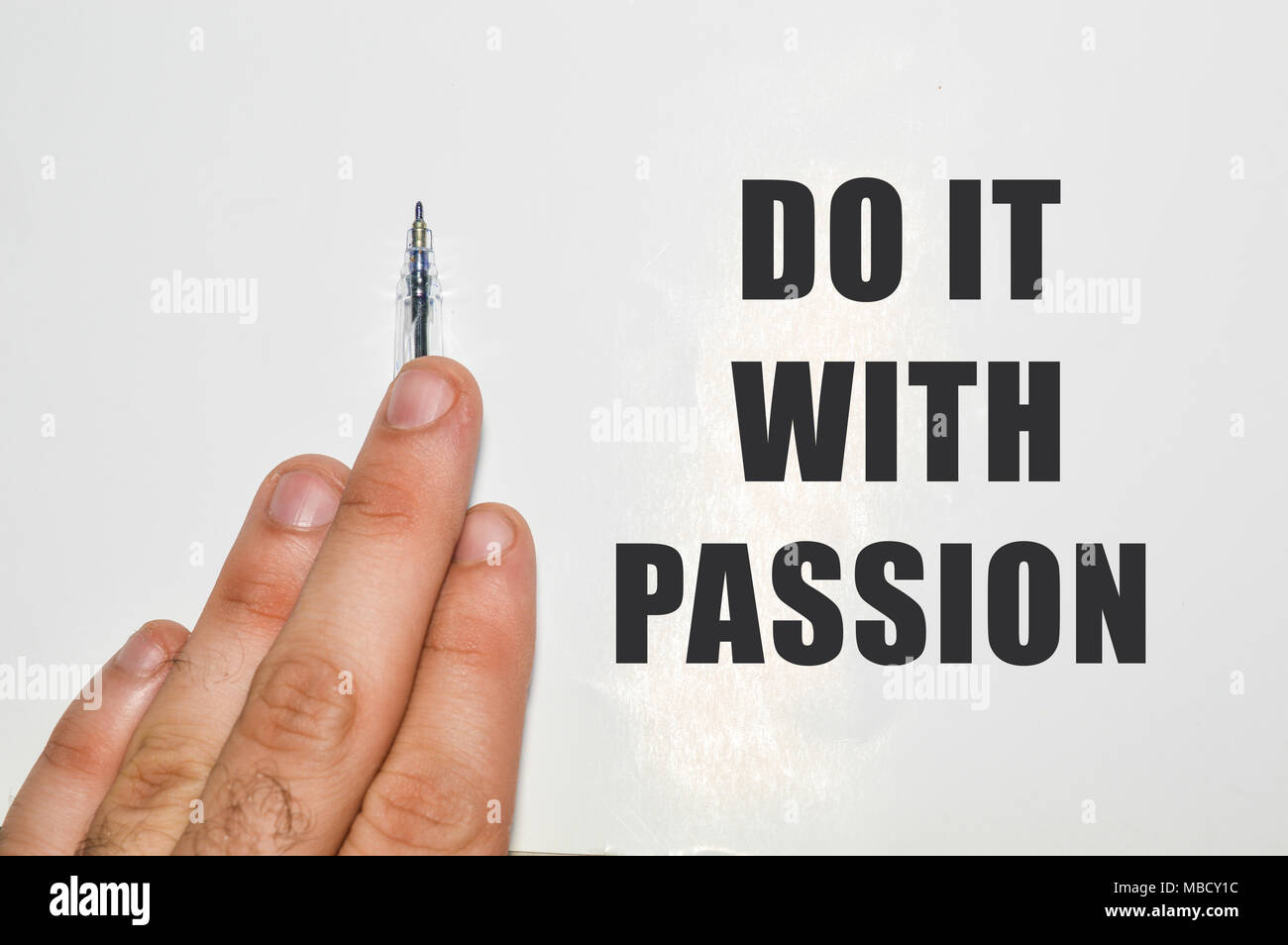 Do it with passion written on white paper Stock Photo - Alamy