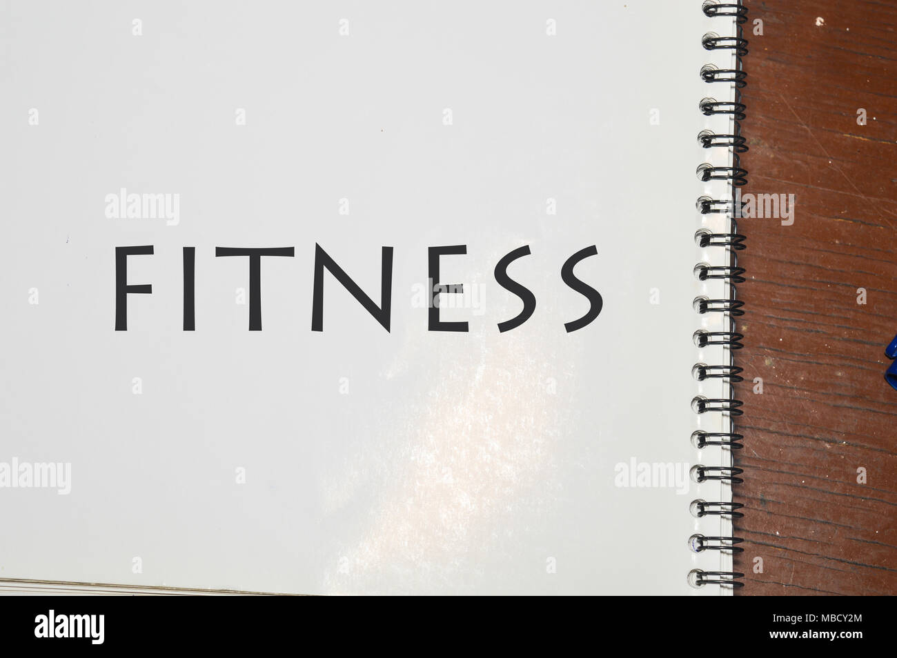 Fitness word written on white paper Stock Photo - Alamy