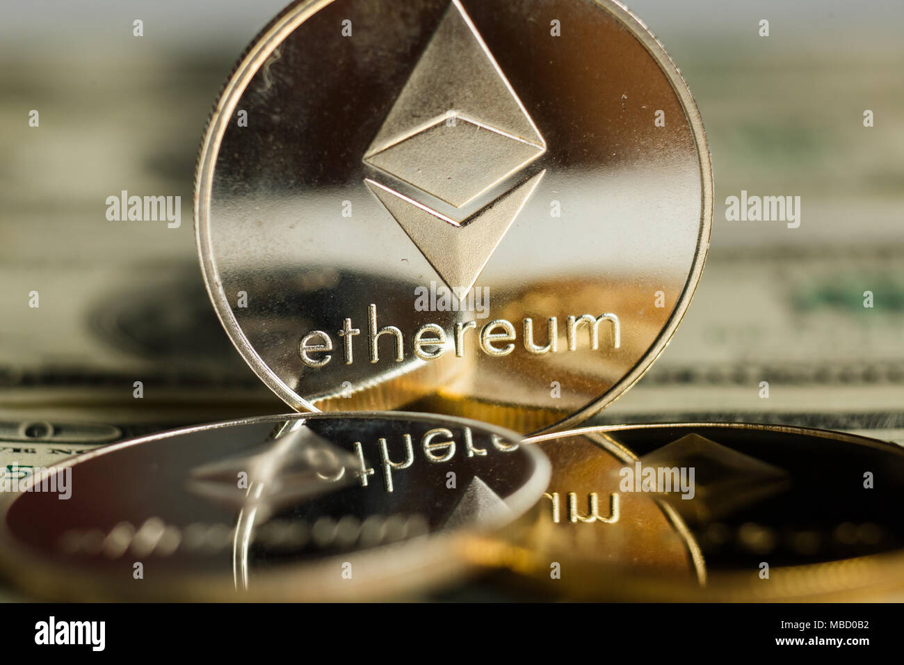 Ethereum coin with other cryptocurrency on dollar notes Stock Photo - Alamy