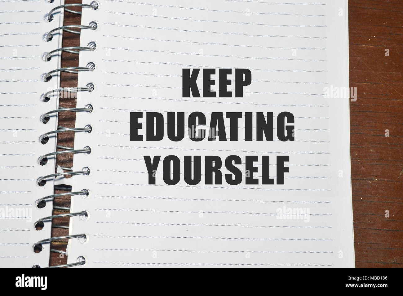 keep educating yourself written on white paper Stock Photo - Alamy