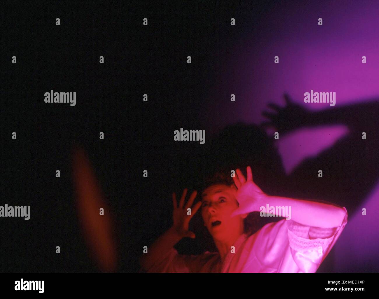 Horror. woman frightened, shadow Stock Photo - Alamy