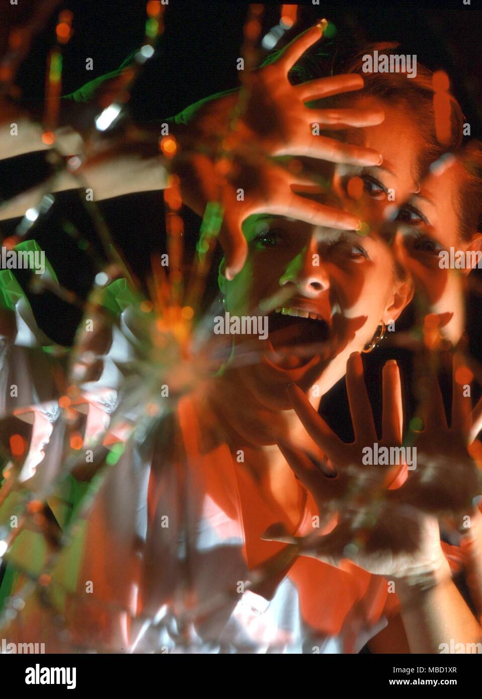 Horror. woman frightened. broken mirror Stock Photo - Alamy