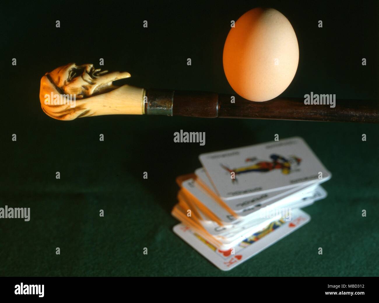Stage Magic - Balancing trick. Balancing an egg on a magic wand. One of ...