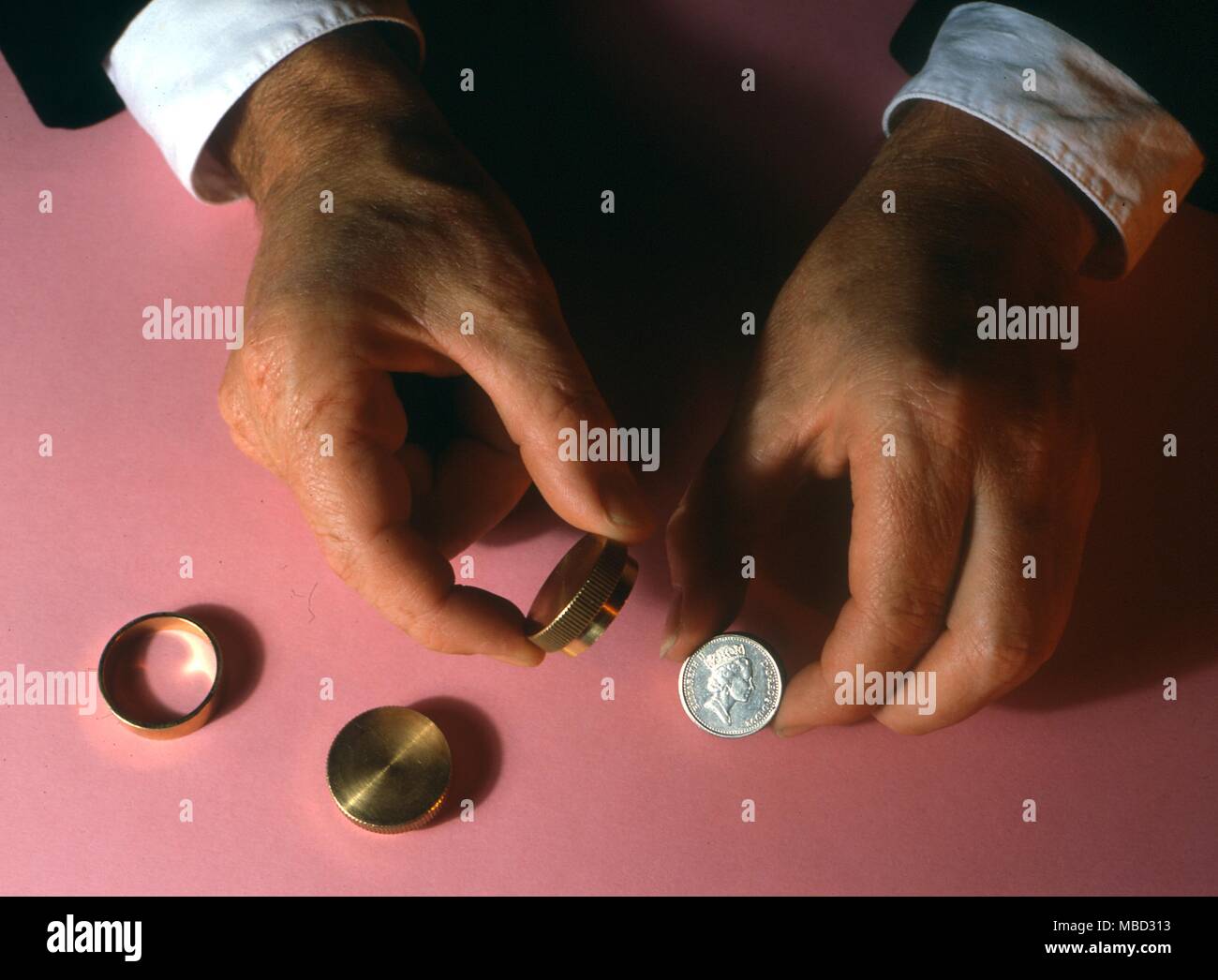 Stage Magic - Coin tricks. View of device used Stock Photo - Alamy