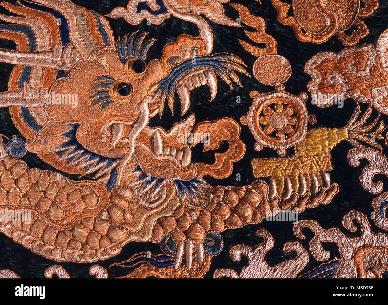 Symbols - Wheel. Thre sacred wheel in the paws of a dragon. Embroidered ...