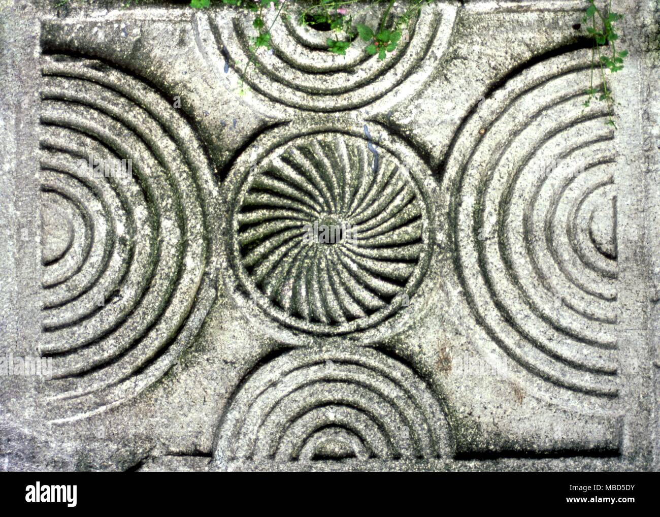 Carving of the Sun with the seven spheres on a slab in the grounds of ...