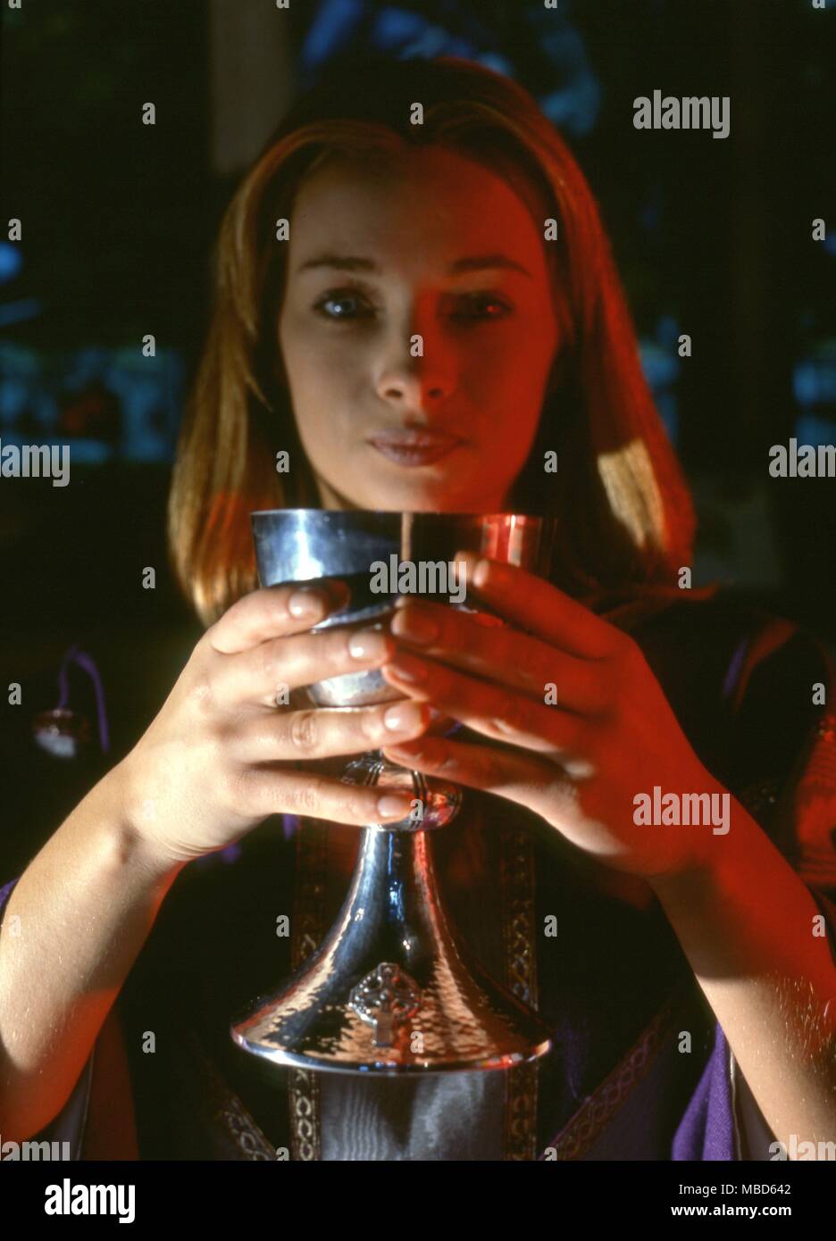 Christian - Woman Priest Priestess at altar with the holy chalice Stock ...