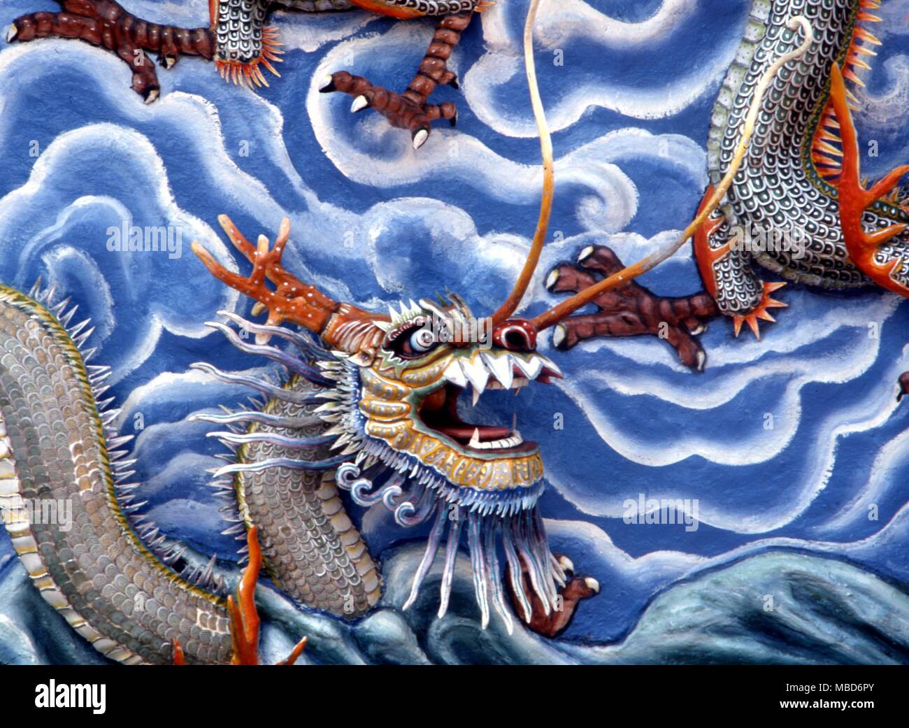DRAGON - Semi-relief dragons painted on a wall in Haw Par Villa in ...