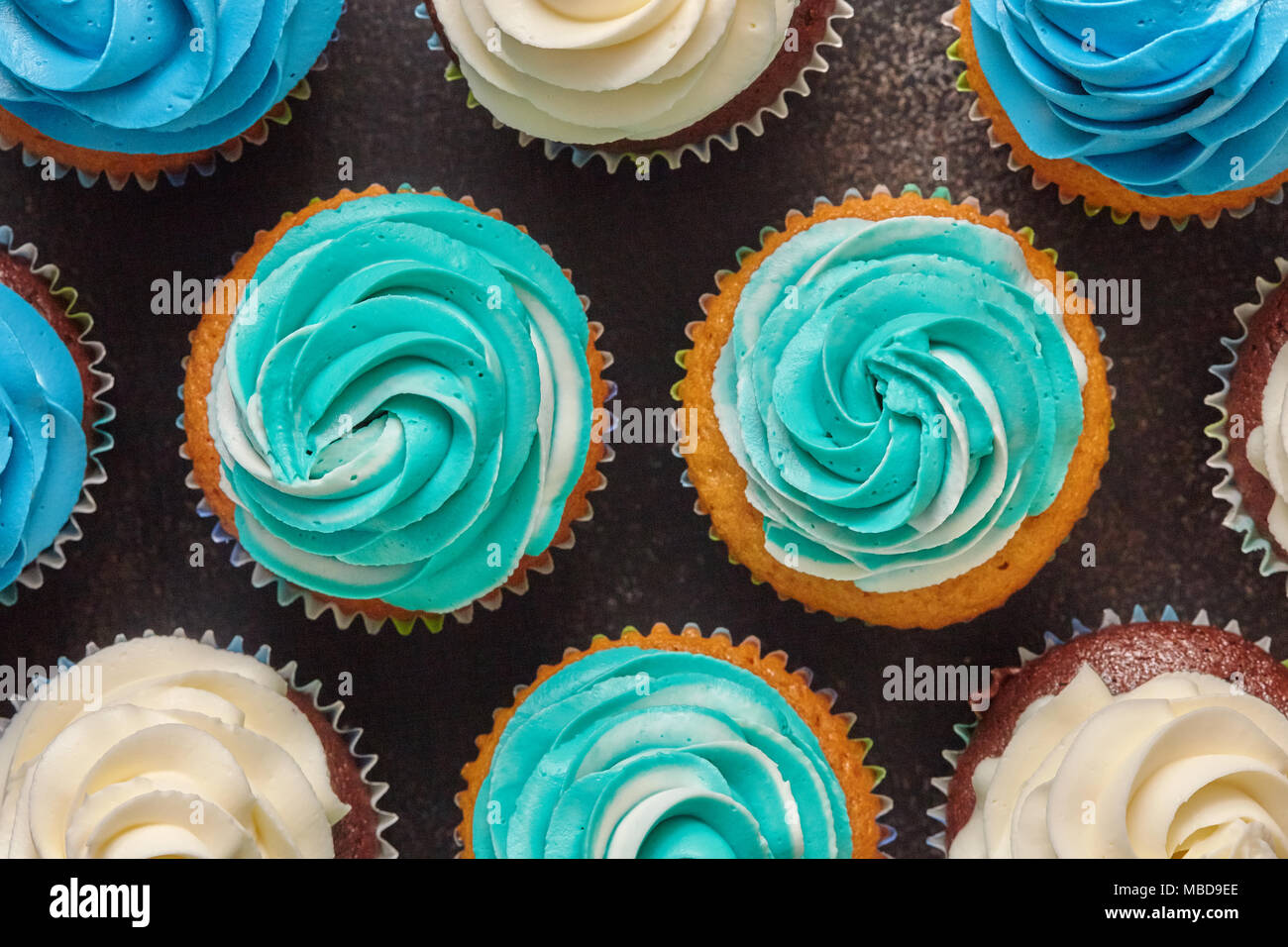 Cupcakes with turquoise and white buttercream frosting, dessert on ...